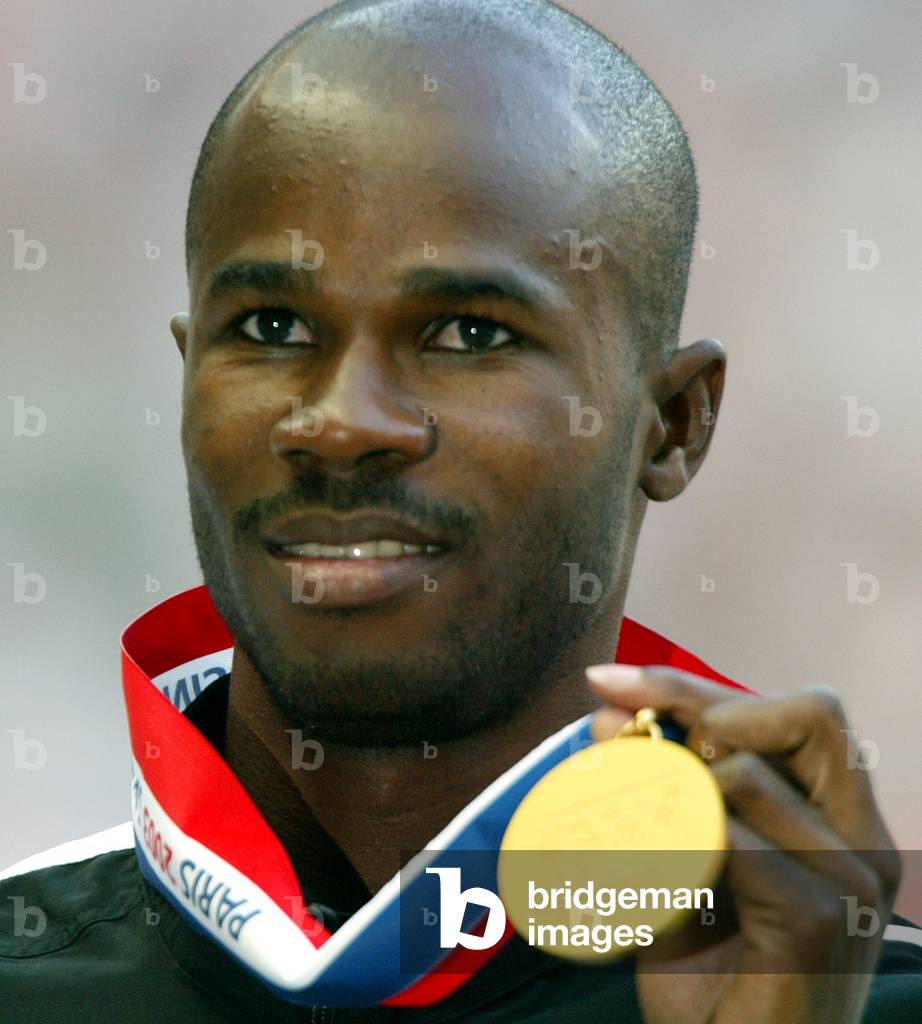 Image of MEN'S 100 METRES GOLD MEDALIST KIM COLLINS AT THE 9TH