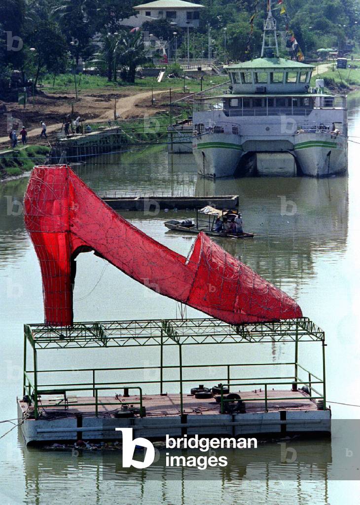 Image of A giant shoe stands high and dry in the Marikina