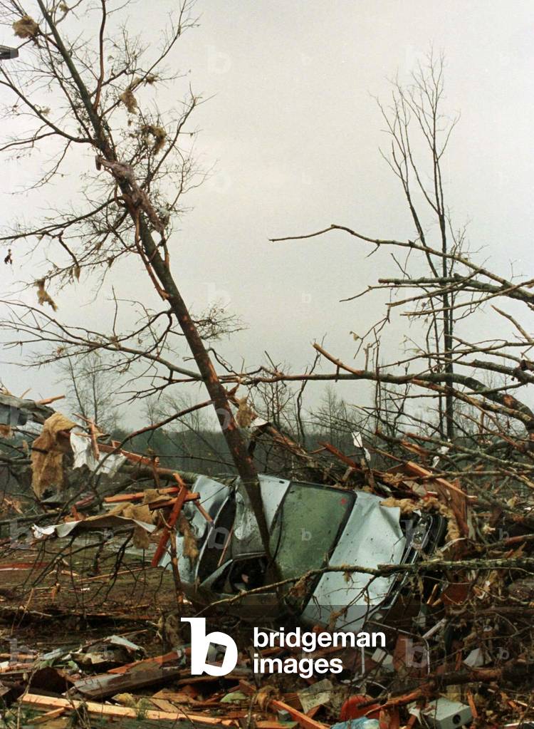 Image of CAR WRAPPED AROUND TREE IN MIDDLE OF TORNADO DAMAGE, 1997-03-02