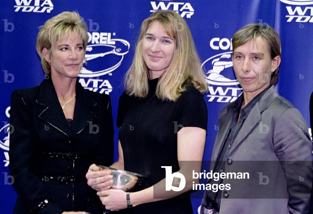 Image of Tennis star Steffi Graf of Germany (C) smiles with former