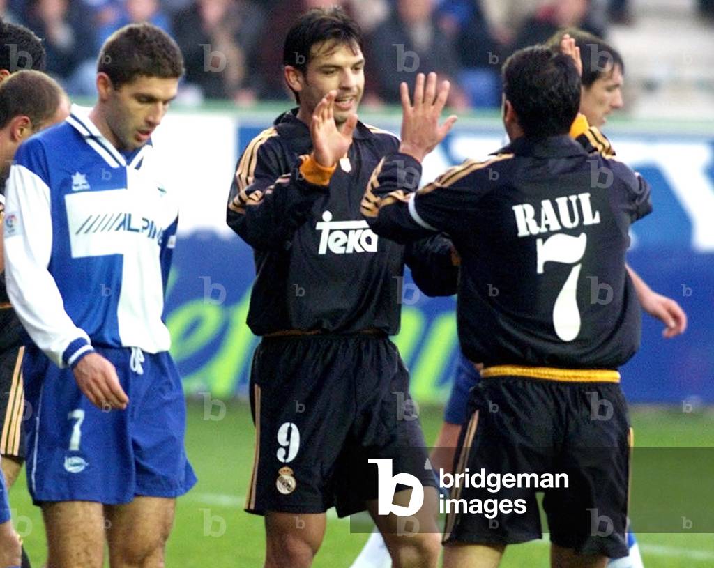 Image of REAL MADRID'S RAUL AND MORIENTES CELEBRATE GOAL IN FRONT OF