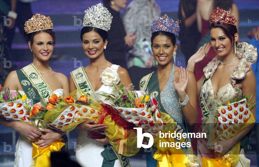 Image of DANIA PRINCE (2ND FROM L), 25, OF HONDURAS POSES FOR