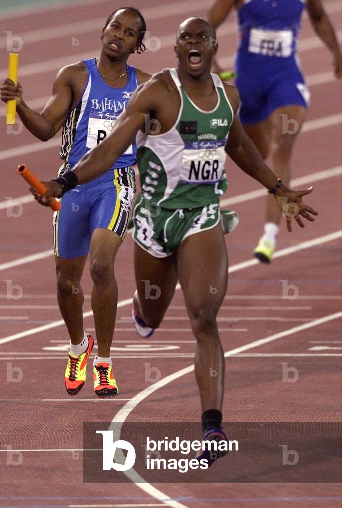 Image of NIGERIA'S UDO-OBONG CROSSES THE LINE IN THE 4X400M RELAY IN