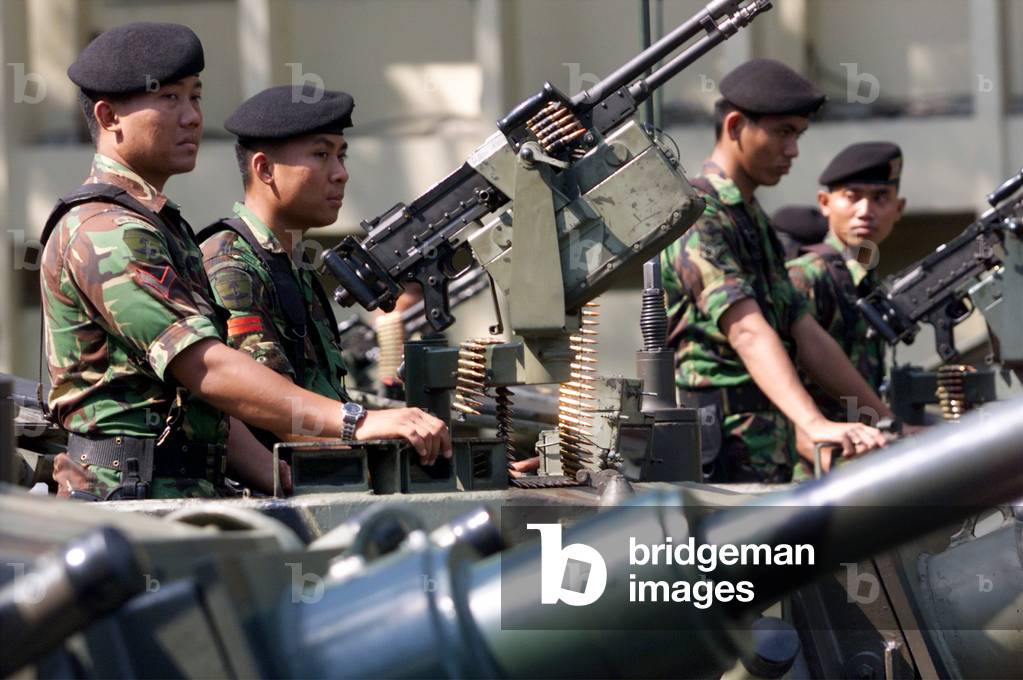 Image of SOLDIERS FROM THE ARMY STRATEGIC COMMAND (KOSTRAD) ON TANKS DURING