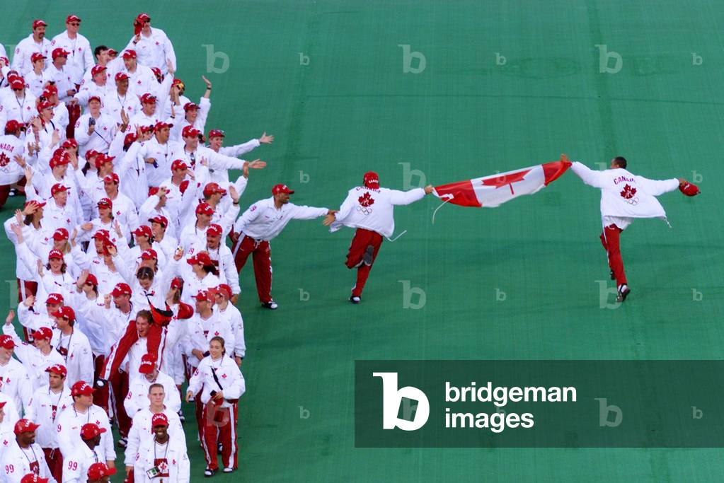 Image of CANADIAN ATHLETES RUN AROUND STADIUM AT PANAM GAMES, 1999-07 ...
