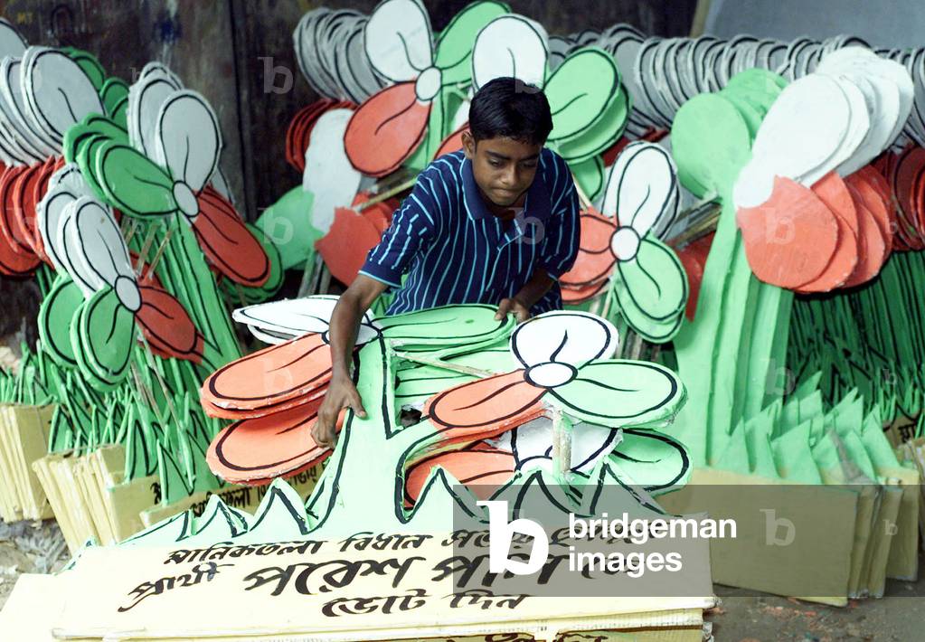 Image of MANTU GHURI WORKS ON CUT-OUTS OF THE SYMBOL OF THE