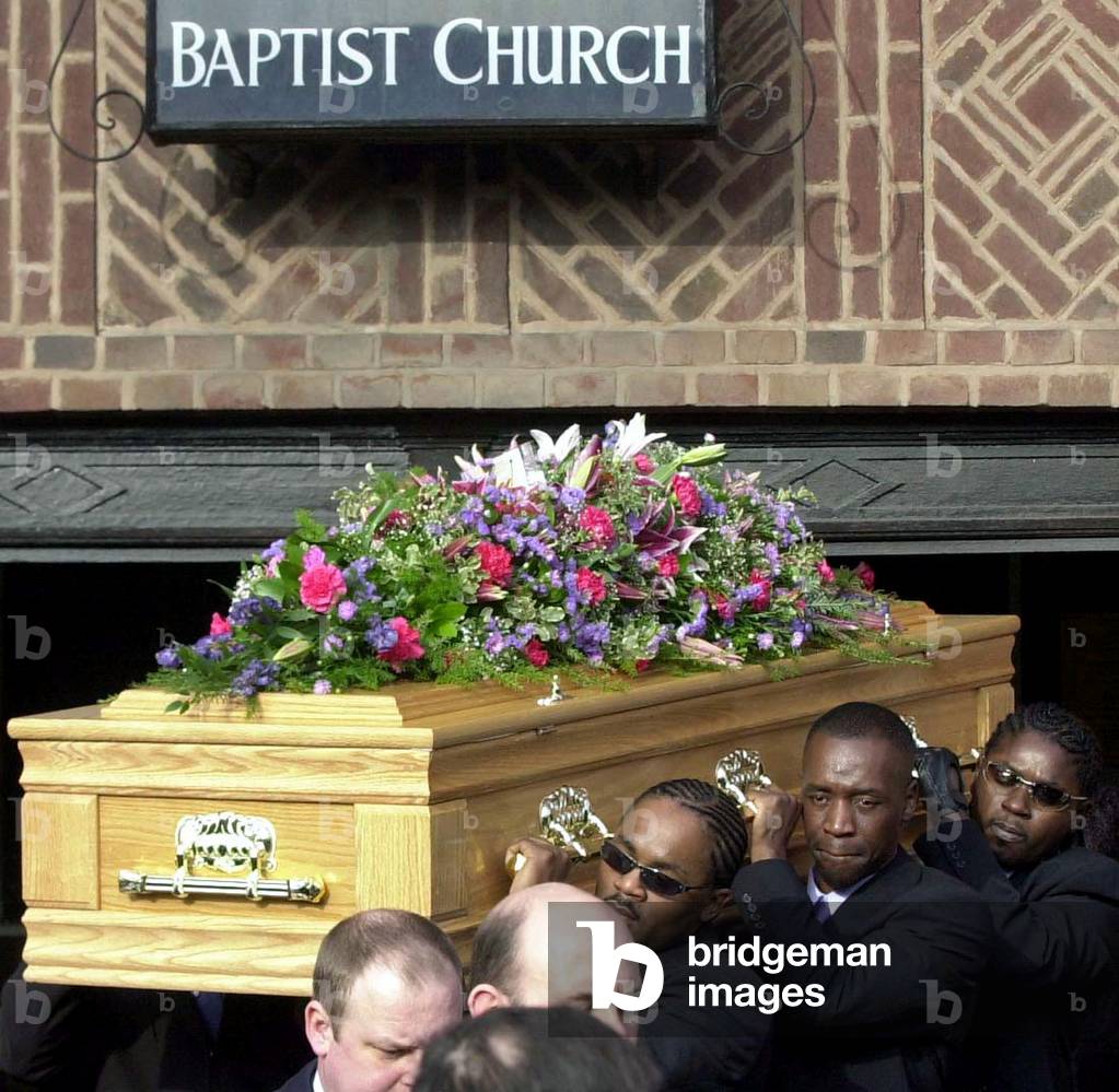 Image of THE COFFIN OF CHARLENE ELLIS IS CARRIED OUT AFTER HER
