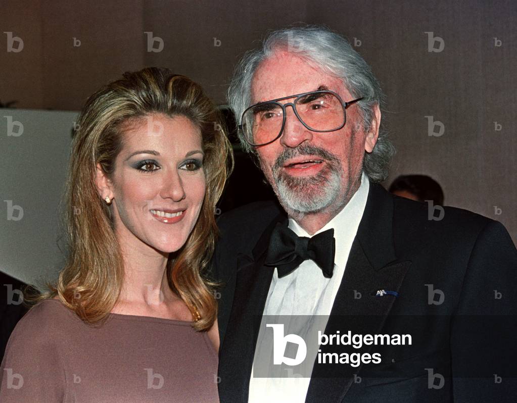 Image of Actor Gregory Peck poses with singer Celine Dion at a