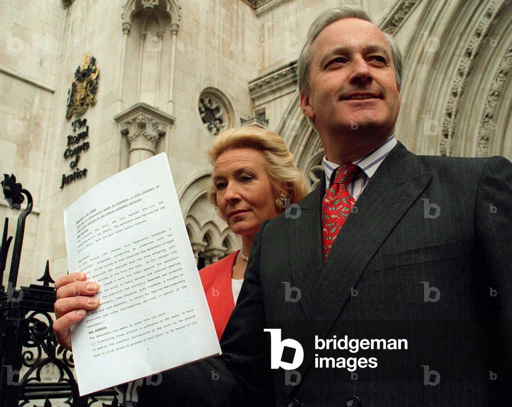 Image of Former Conservative MP Neil Hamilton poses with his wife Christine