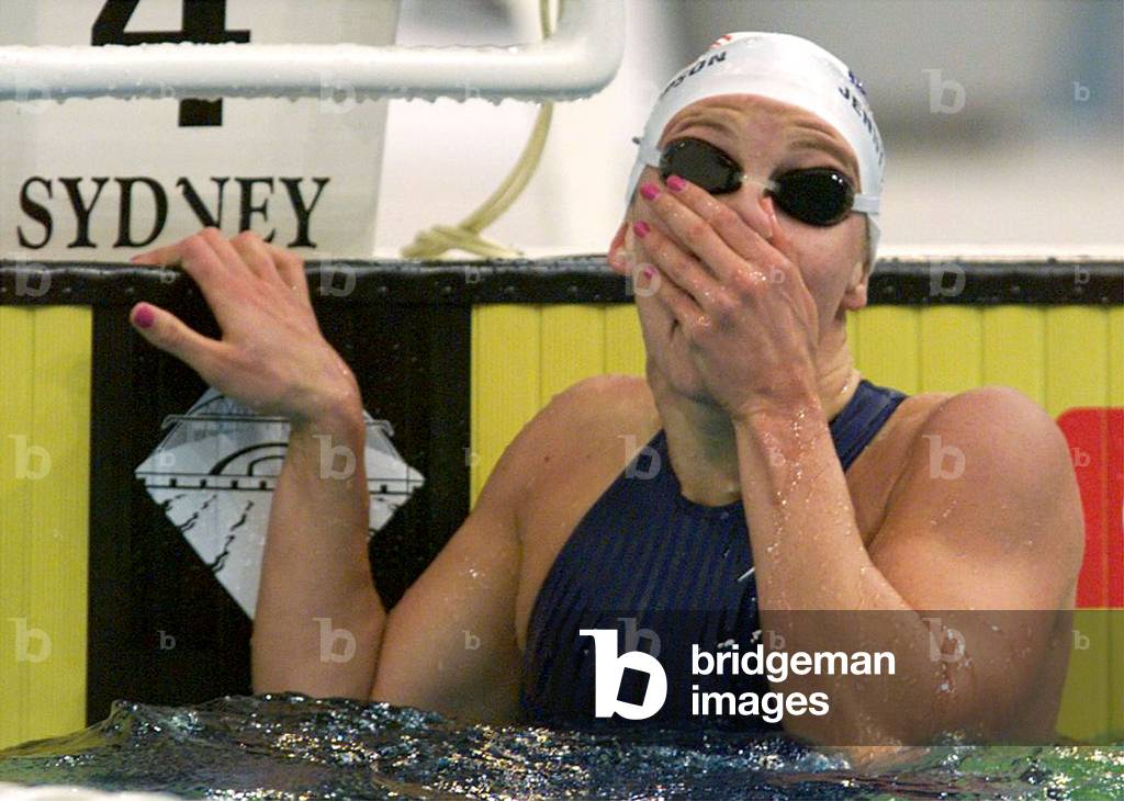 Image of USA'S JENNY THOMPSON REACTS AFTER SWIMMING A NEW WORLD RECORD