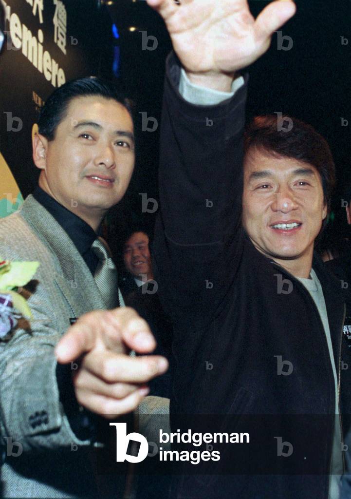 Image of Hong Kong action superstar Jackie Chan (R) acknowledges fans as