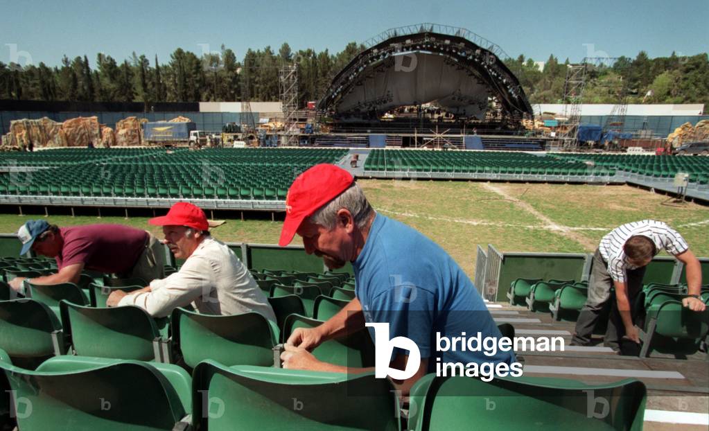 Image of WORKERS PREPARE ROWS OF SEATS IN JERUSALEM STADIUM FOR ISRAELS