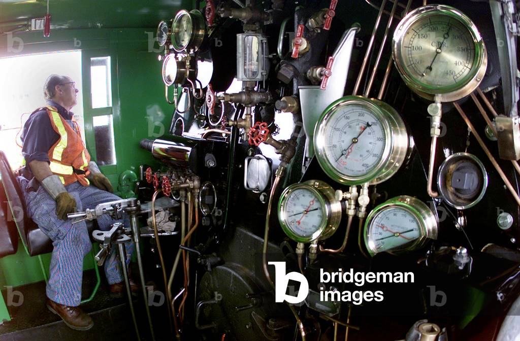 Image of FIREMAN SITS IN THE CAB OF FULLY RESTORED CPR EMPRESS