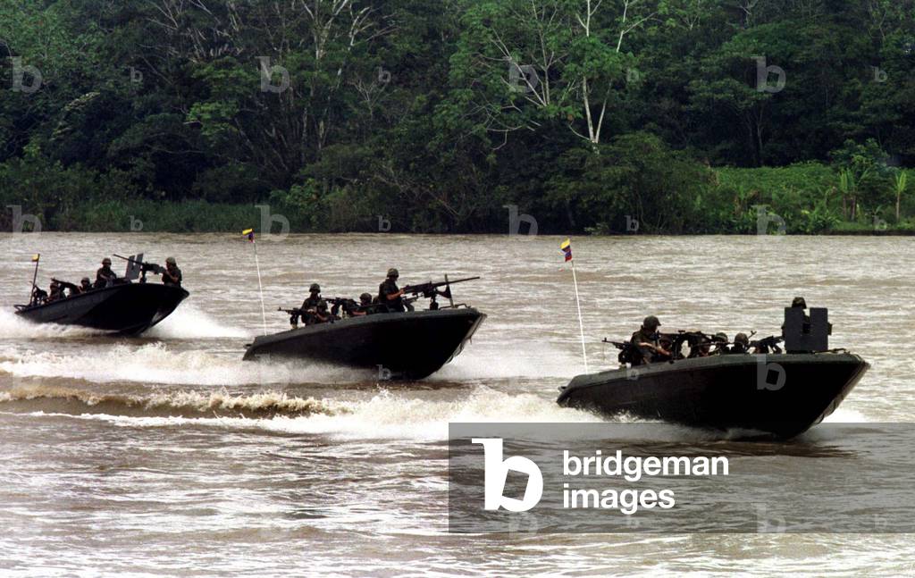 Image of Colombian Naval boats perform exercises on the Putumayo River in