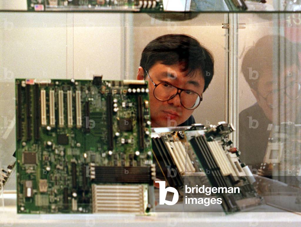 Image of SUPERMICRO ENGINEER LOOKS AT MOTHERBOARDS IN HANOVER, 1998-03 ...
