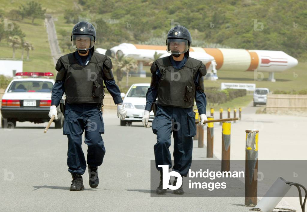 Image of POLICE PATROL AT TANEGASHIMA SPACE CENTRE BEFORE LAUNCH OF ...