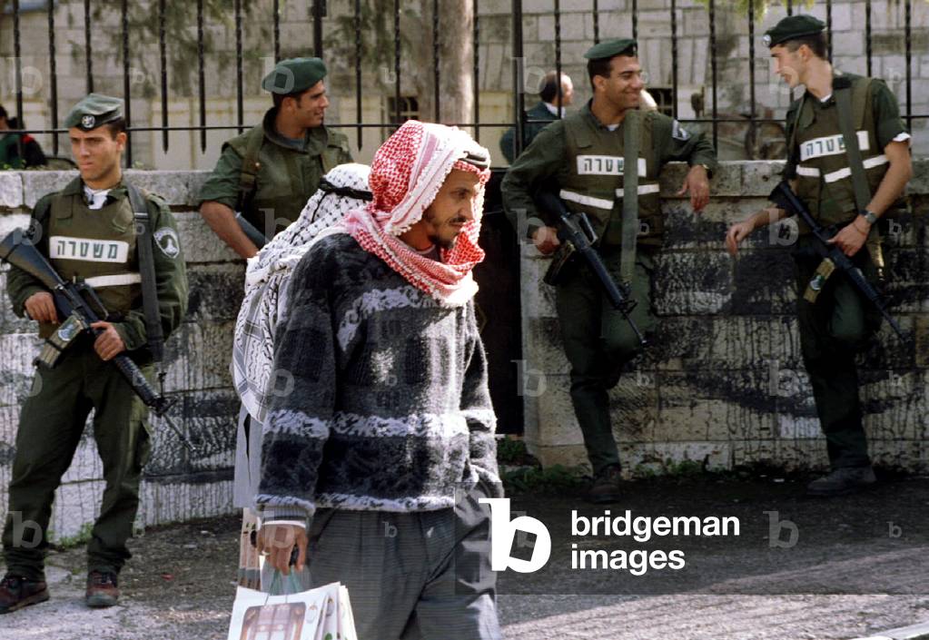 Image of Israeli Border Police stand at the New Orient House, the