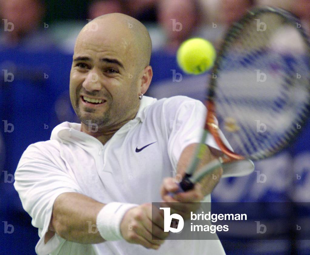 Image of ANDRE AGASSI OF THE US HITS A BACKHAND DURING HIS