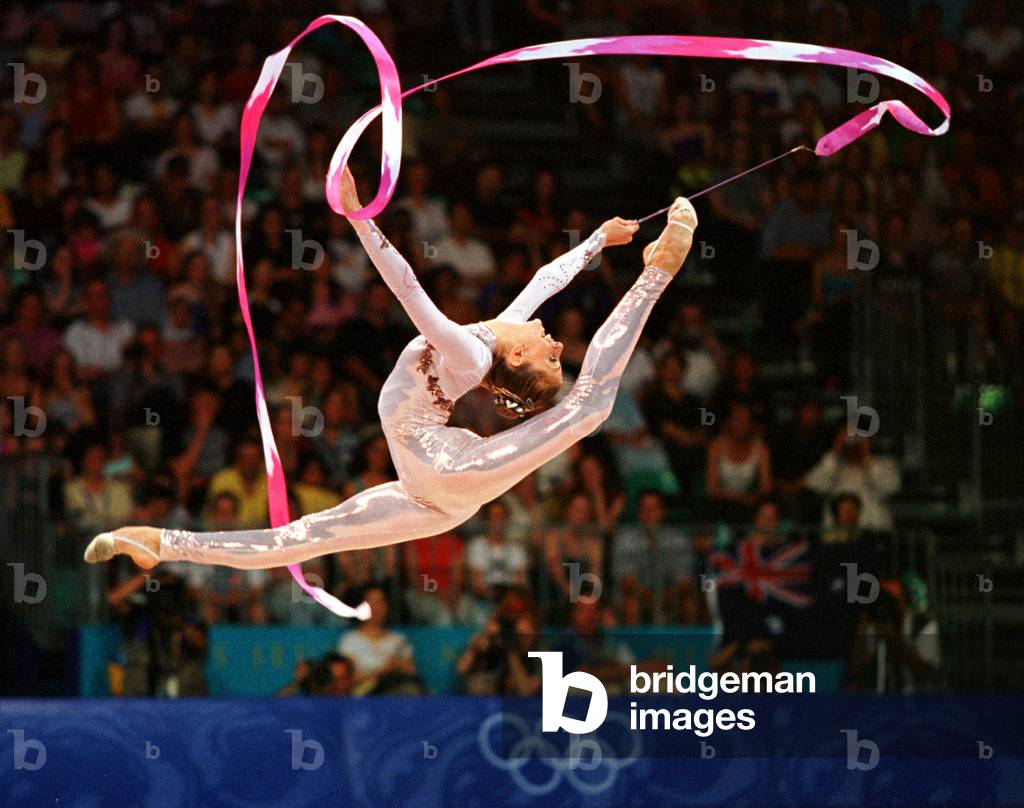 Image of Eva Serrano of France leaps through the air as she