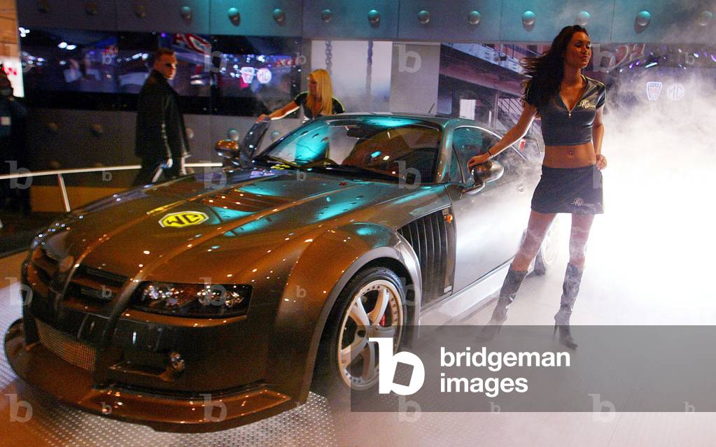 Image of A model introduces the new MG Rover X80 Coupe at