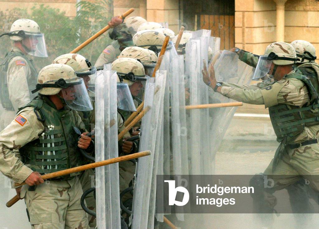 Image of U.S. MILITARY POLICE HOLDS RIOT CONTROL TRAINING IN FRONT OF