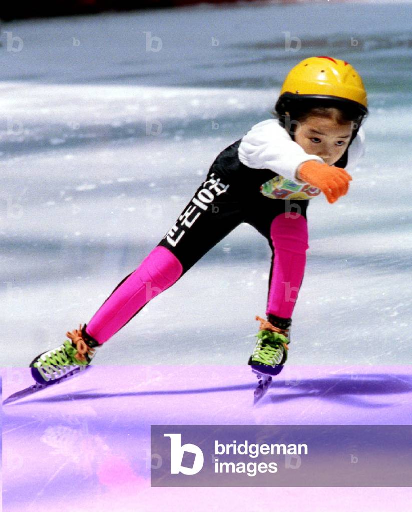 Image of A South Korean child practises speed skating at an ice