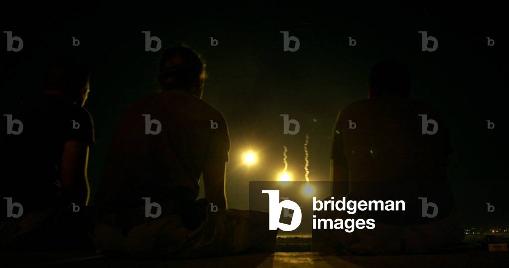 Image of U.S. SOLDIERS LOOK AT FLARES FIRED BY THE U.S. ARMY