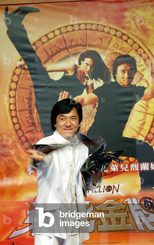 Image of HONG KONG MOVIE STAR JACKIE CHAN THROWS T-SHIRTS TO FANS