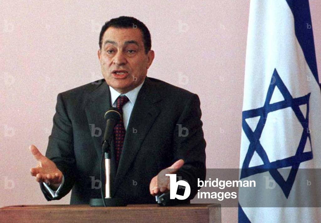 Image of Egyptian President Hosni Mubarak gestures as he answers ...