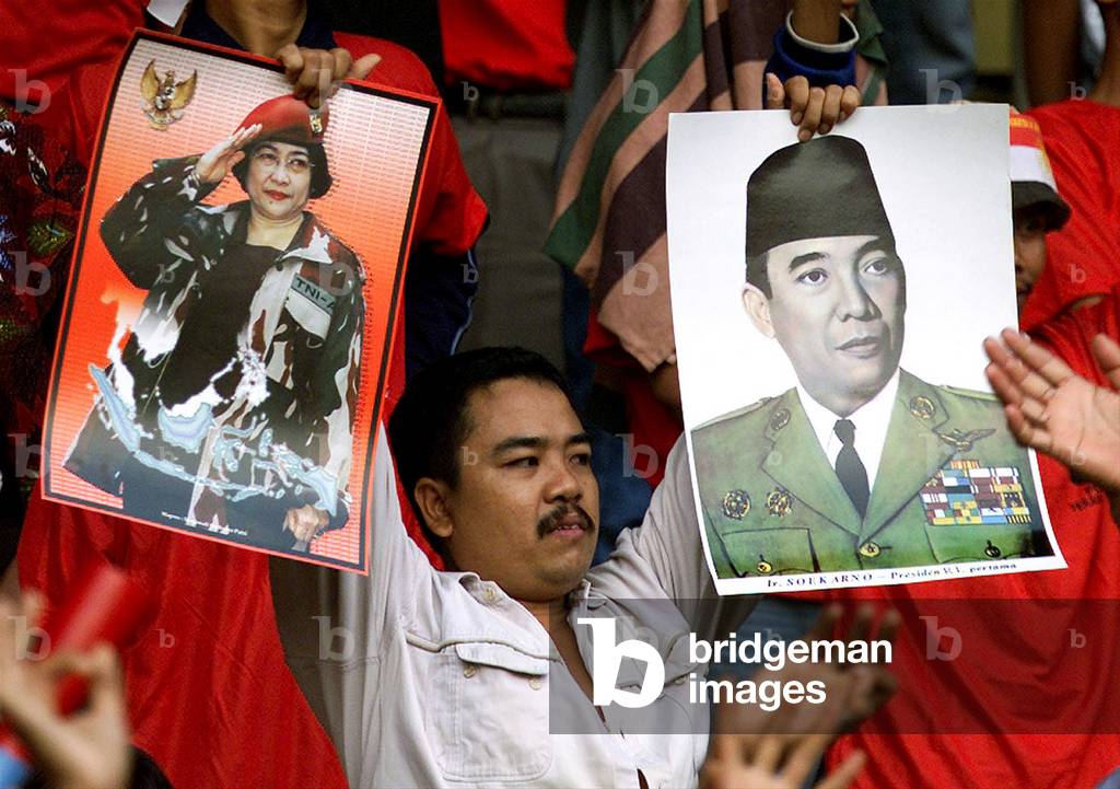 Image of MEGAWATI SUPPORTER WAVES POSTERS AT CELEBRATIONS FOR 100TH ...