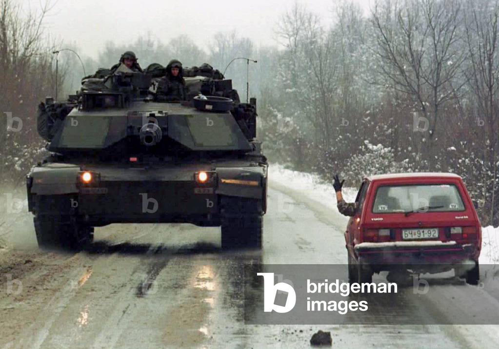Image of The driver of a tiny car moves over for a