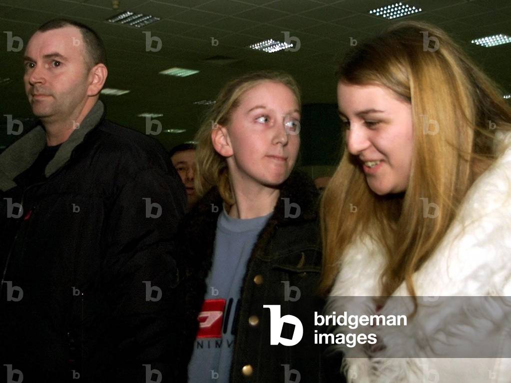 Image of BRITISH SCHOOLGIRL RACHEL LLOYD IS ACCOMPANIED BY HER FATHER AND