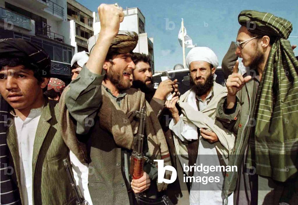 Image of Afghan Taliban Islamic militia fighters cheer Mullah Rahman ...