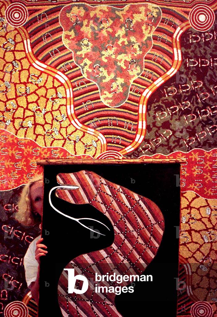 Image Of Helen Hanson From The Hogarth Aboriginal Art Centre Holds Up
