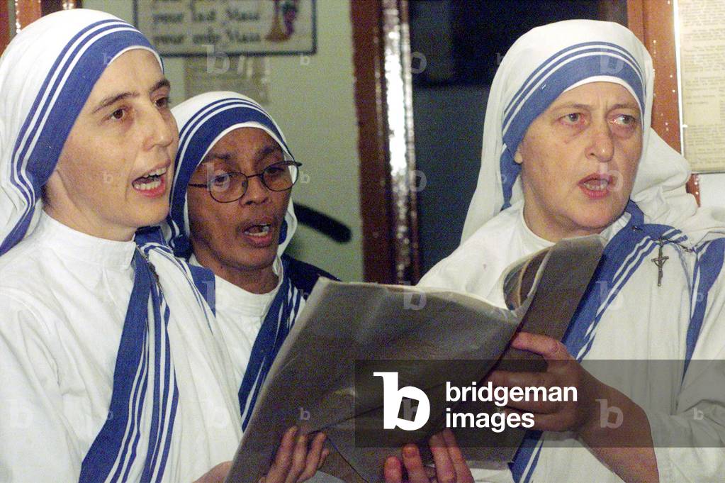 Image of CATHOLIC NUNS OF MISSIONARIES OF CHARITY SING HYMMS DURING MASS