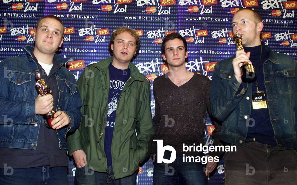 Image of COLDPLAY POSE WITH THEIR AWARDS FOR THE BEST BRITISH GROUP