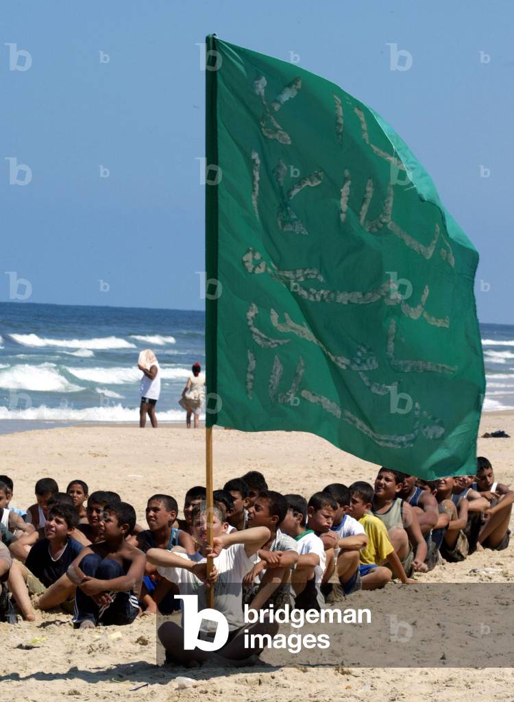 Image of YOUNG HAMAS PALESTINIAN BOYS TRAIN ON BEACH IN GAZA STRIP,