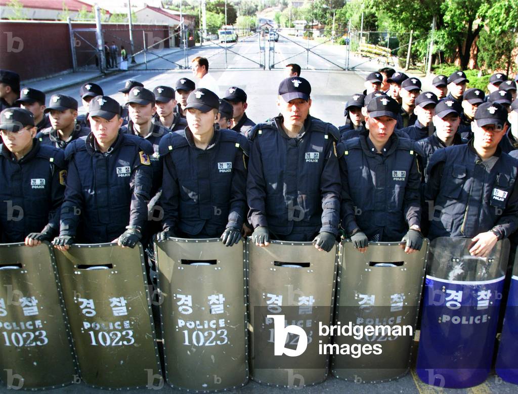 Image of SOUTH KOREAN RIOT POLICE GUARD THE MAIN ENTRANCE OF U.S.