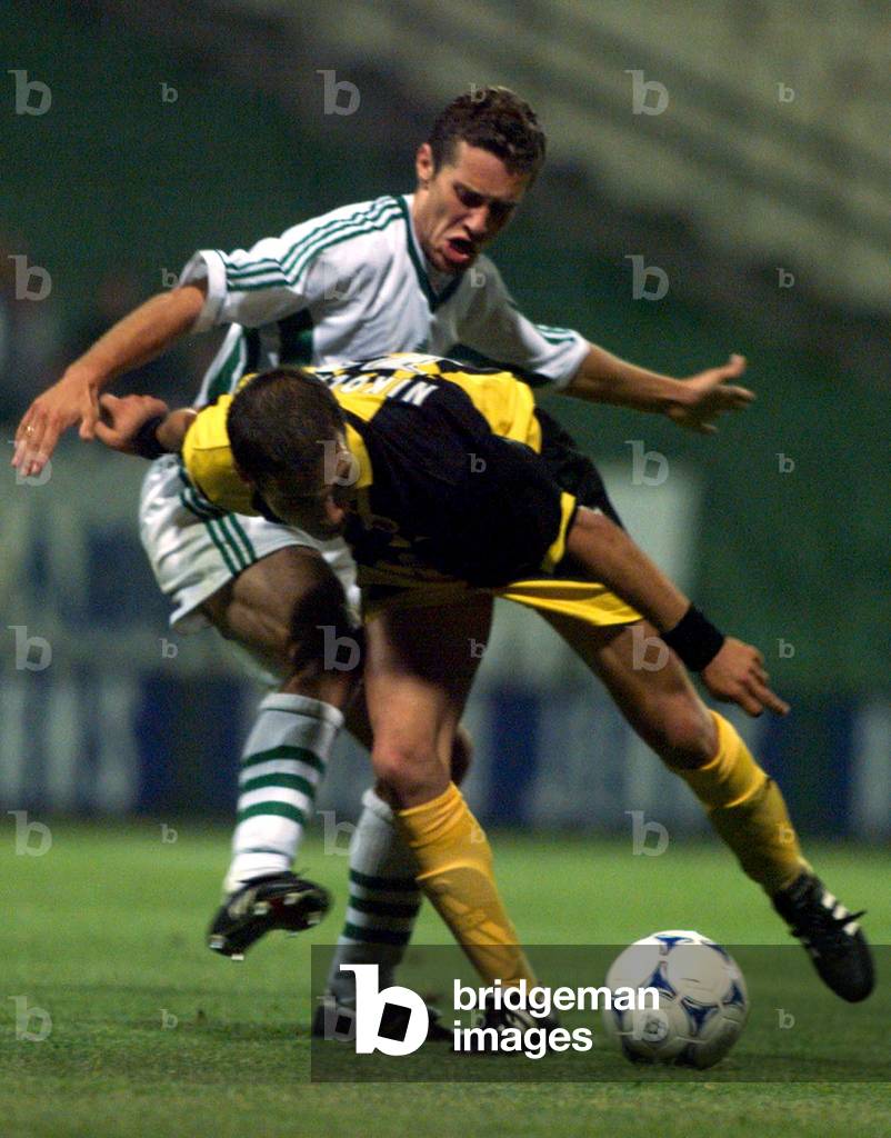 Image of THEMISTOK NIKOLAIDIS OF AEK ATHENS AND MIHALY SZUCS OF HUNGARY'S