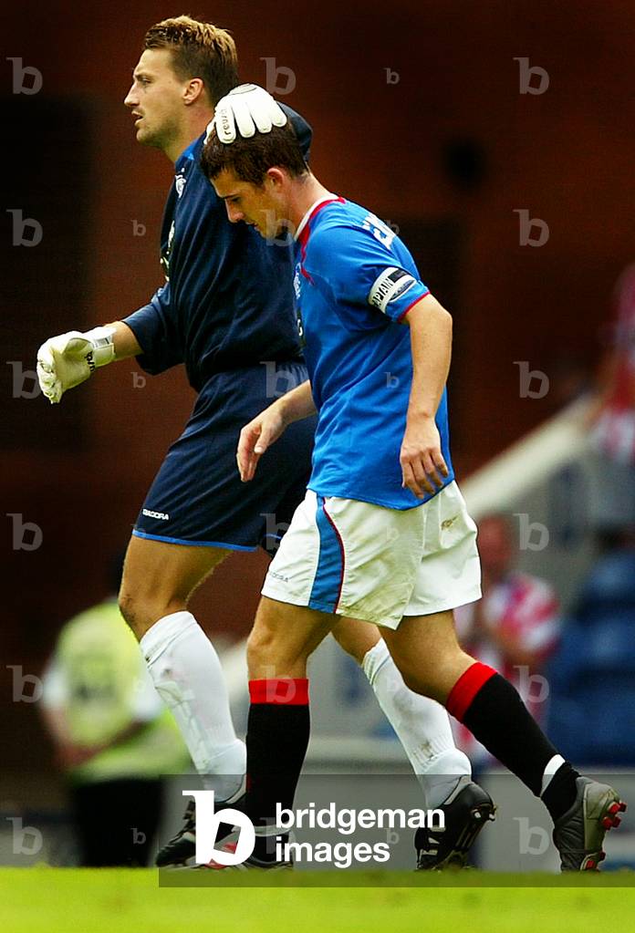 Image of RANGERS GOALKEEPER KLOS PATS CAPTAIN FERGUSON ON THE HEAD AFTER
