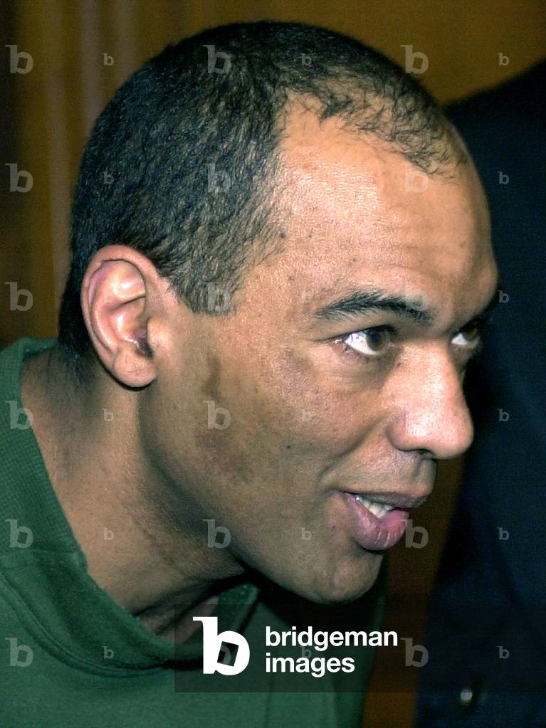 Image of Accused French serial killer Guy Georges appears in the courtroom