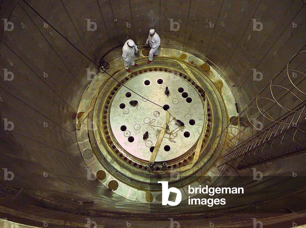 Image of Workers repair a pipe inside of the first and