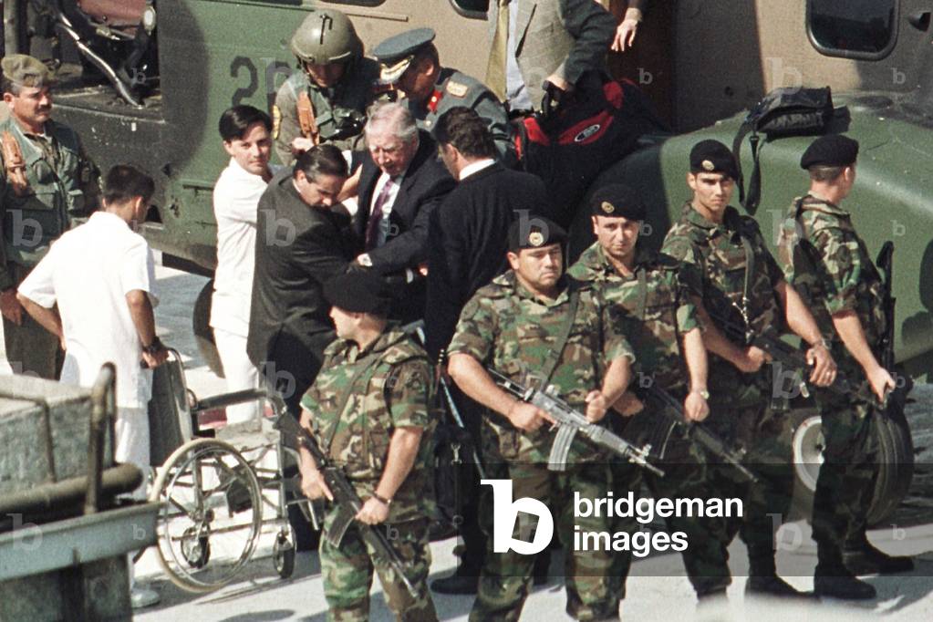 Image of Former dictator of Chile, Augusto Pinochet (top center, with grey