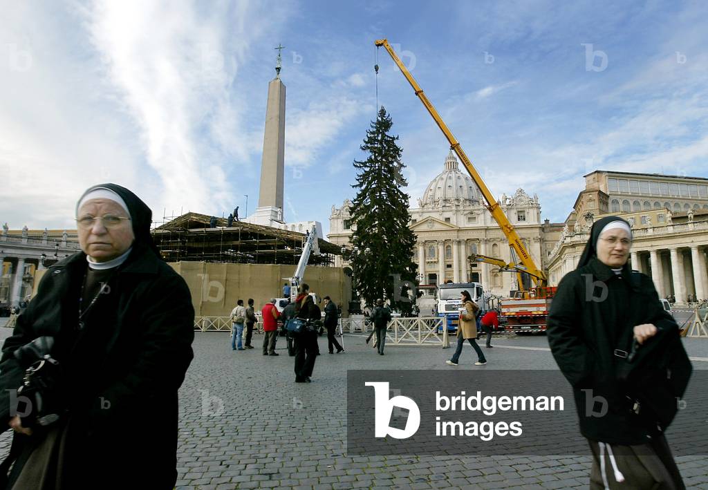 Image of TWO NUNS STROLL THROUGH SAINT PETER'S SQUARE AS A LARGE