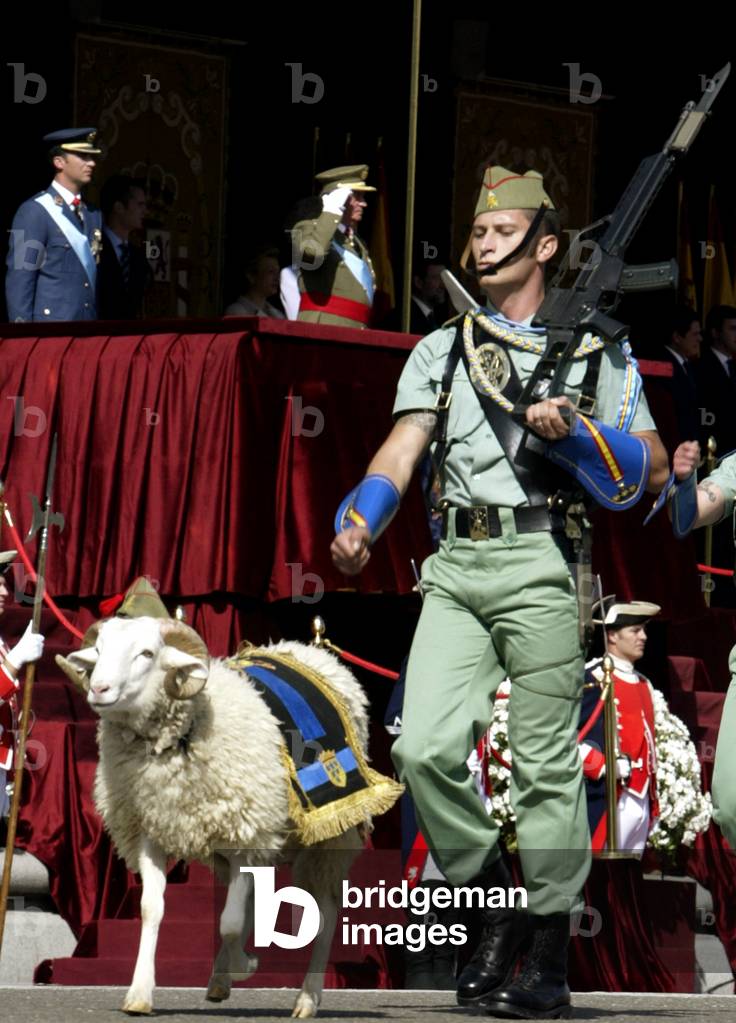 Image of LEGION MEMBER WITH MASCOT PARADES IN FRONT OF KING JUAN