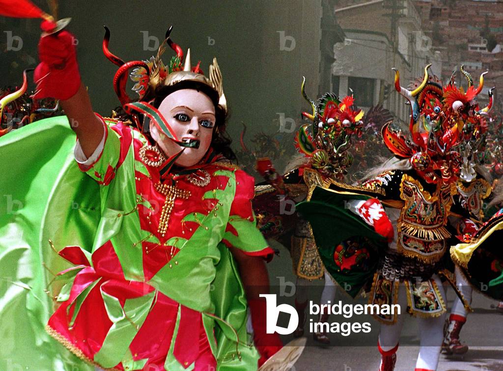 Image of A character representing the archangel Michael (L) and 'devils ...