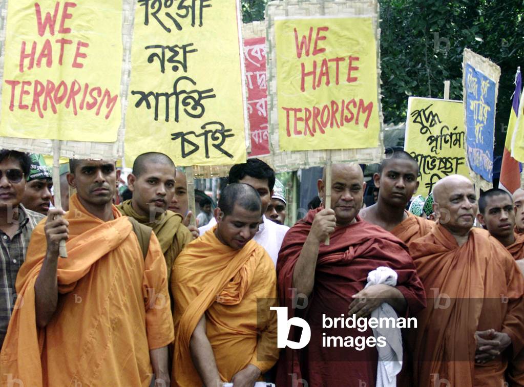 Image of Hundreds of Bangladesh Buddhist monks and devotees stage a peace