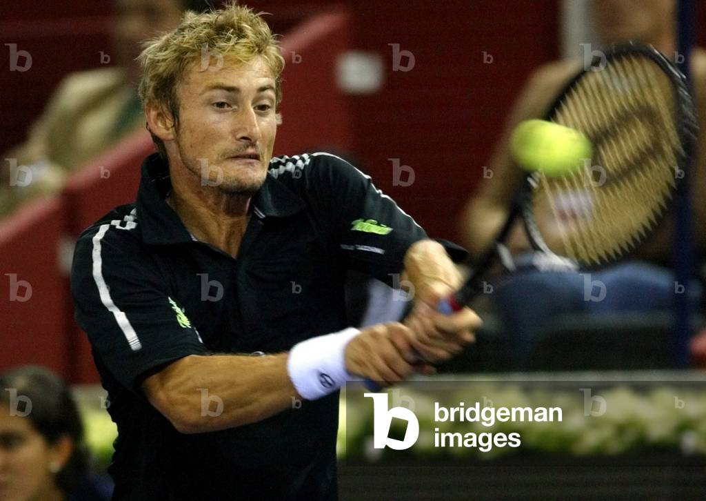 Image of SPANISH FERRERO RETURNS A BALL TO THAILAND'S SRICHAPHAN DURING ...