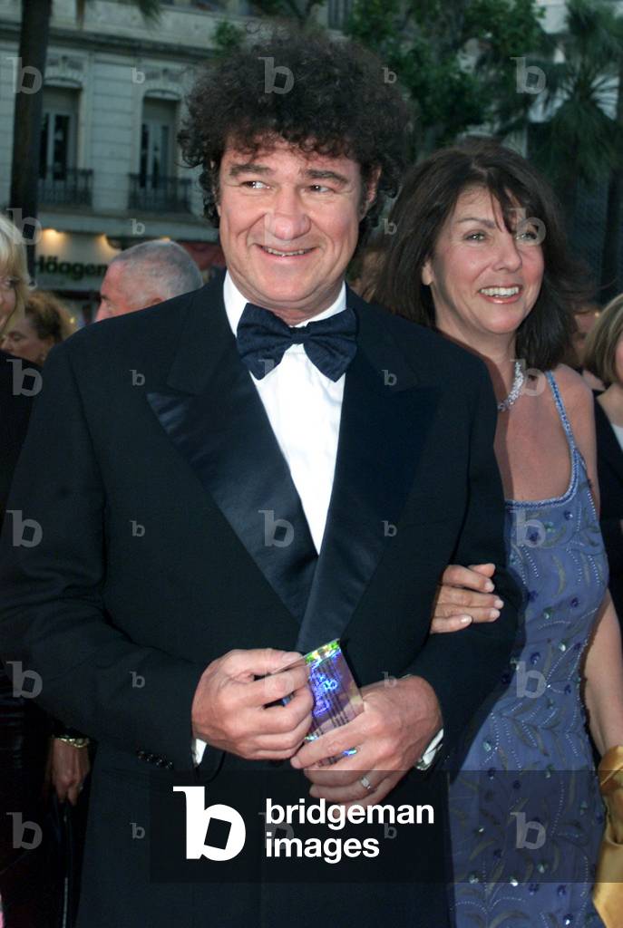 Image of Canadian singer Robert Charlebois arrives with his wife for the