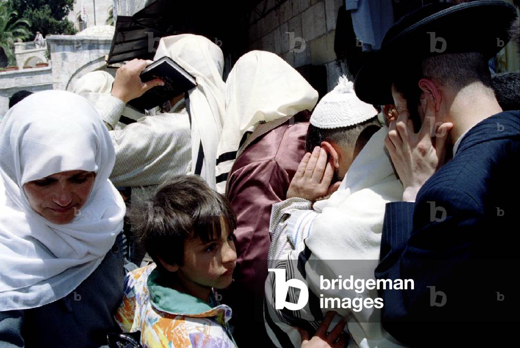 Image of Ultra-orthodox Jews on their way back from prayers at the